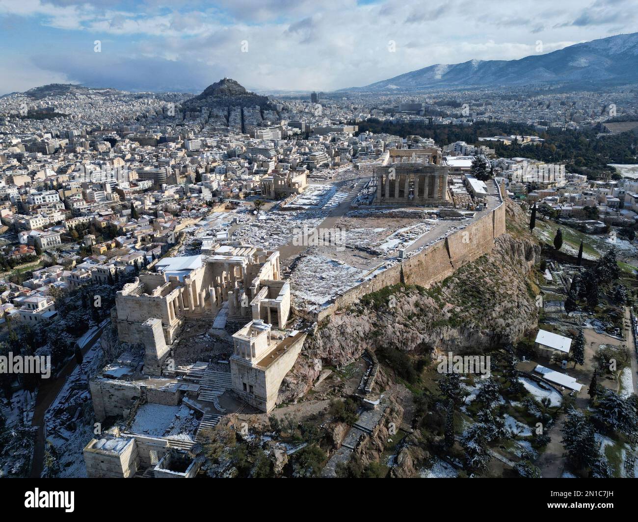 Parts of the Acropolis are covered in snow as the Parthenon temple ...