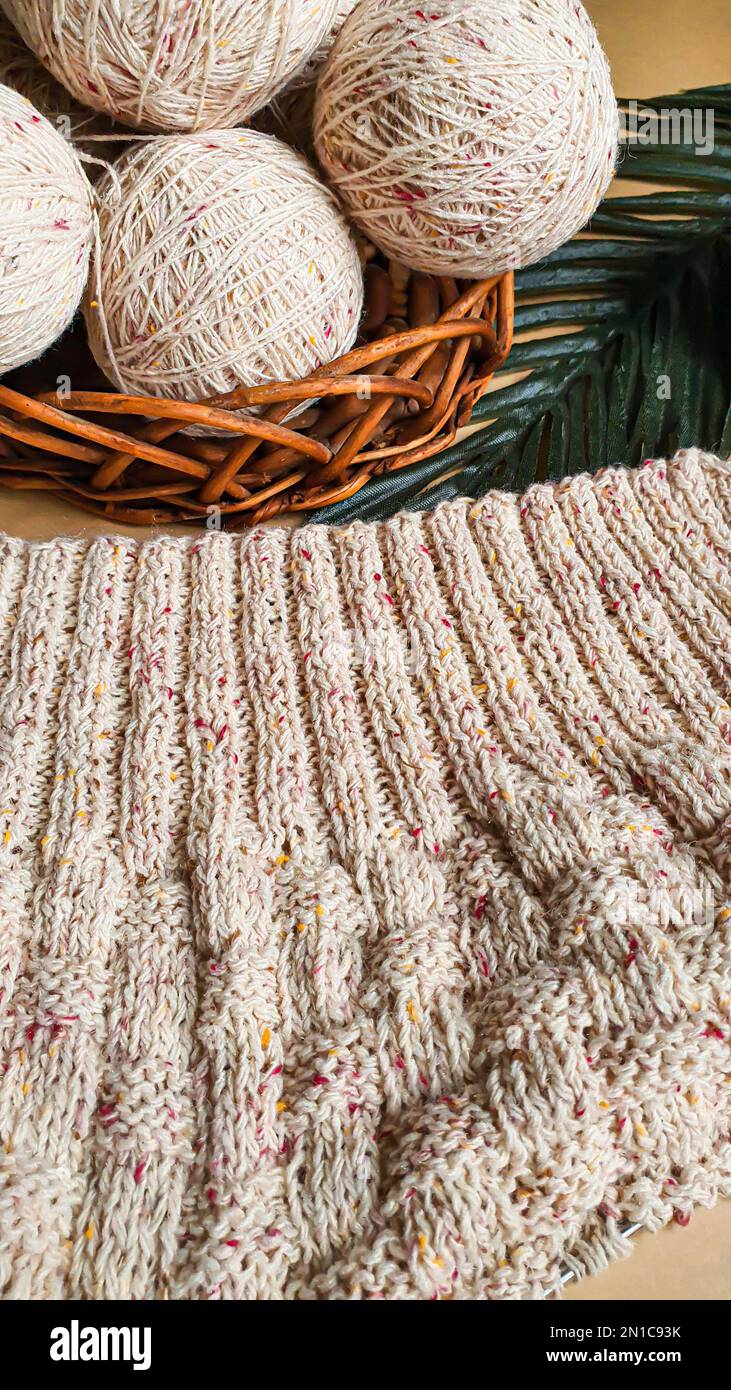 Knitted handmade items. Knitted fabric from colored thread. Bright ...