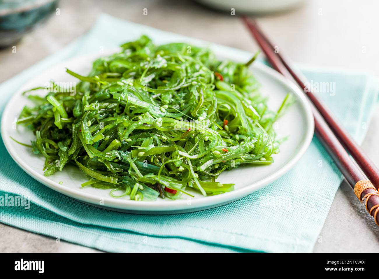 Green seaweed. Japanese wakame salad on the plate Stock Photo - Alamy