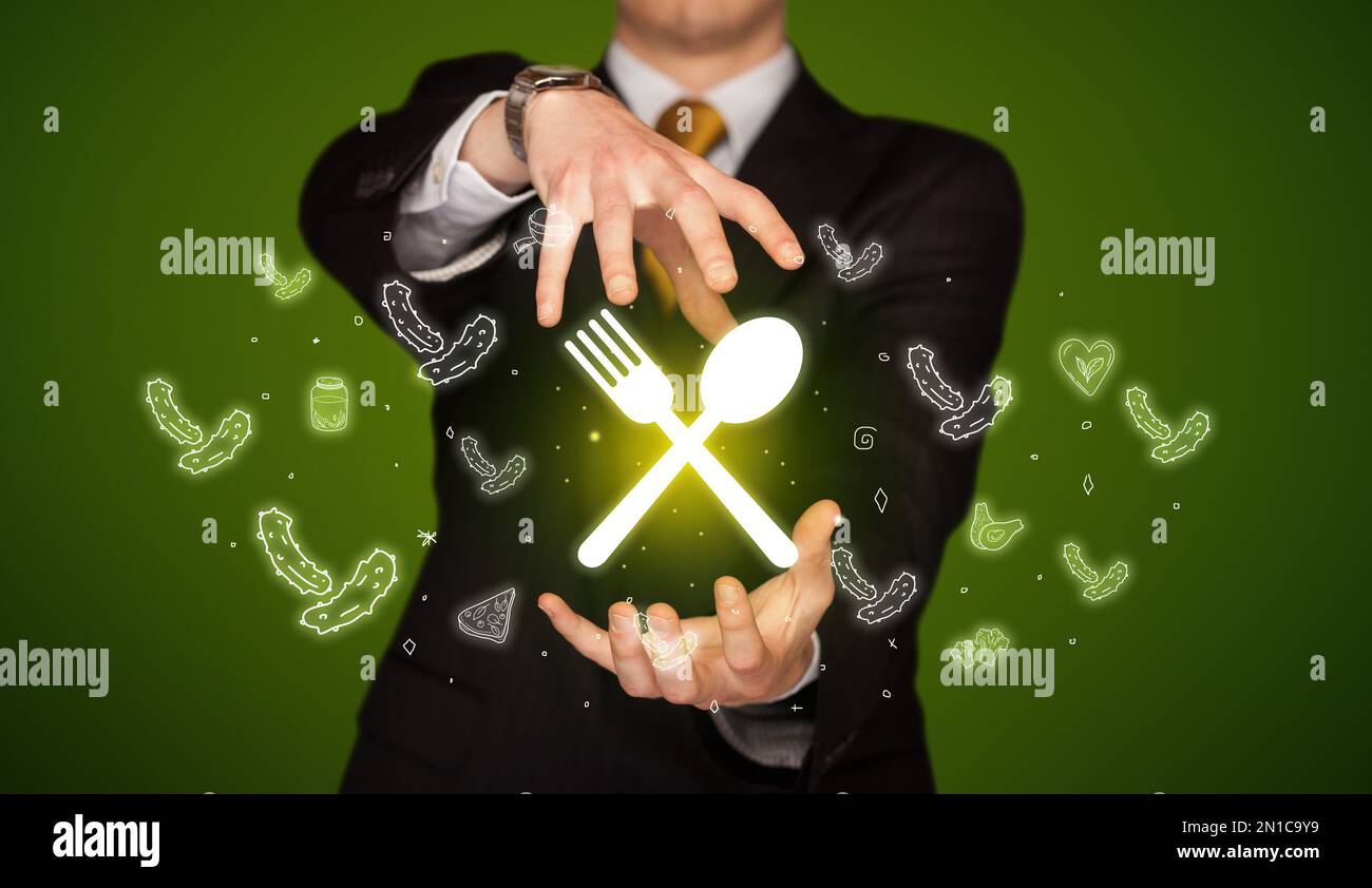 Hand holding food related icons Stock Photo - Alamy