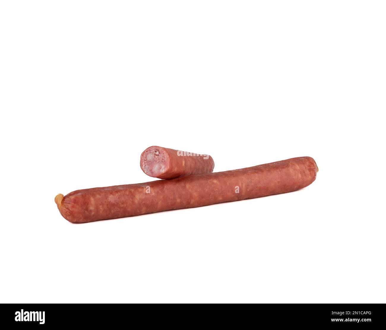 Whole and half thin half-smoked sausage on a white background. Copy ...