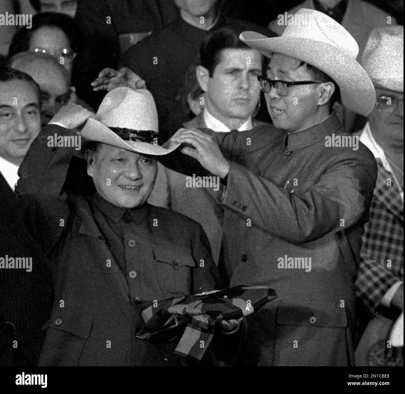 FILE - In this Feb. 2, 1979 file photo, an aide helps Chinese former ...