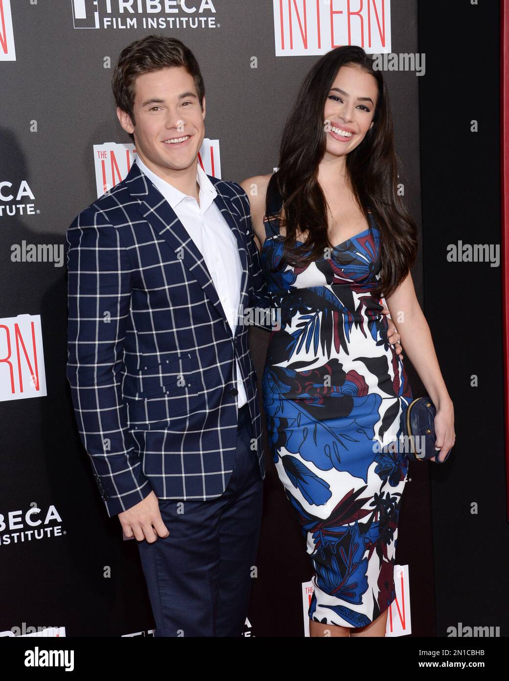 Actors Adam Devine and girlfriend Chloe Bridges attend the premiere of ...