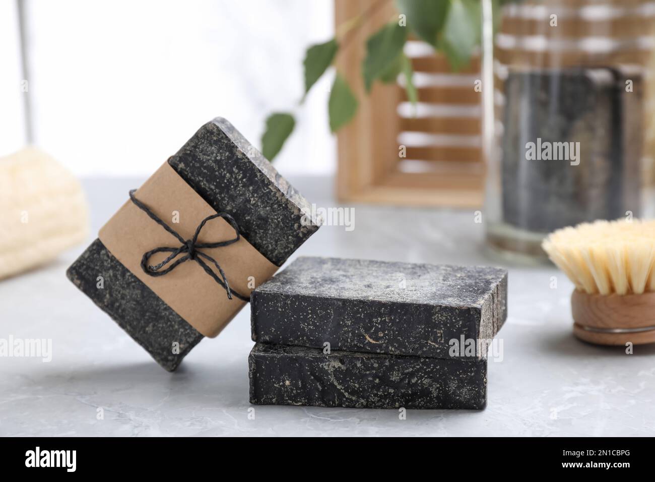 Natural tar soap on light grey table Stock Photo - Alamy