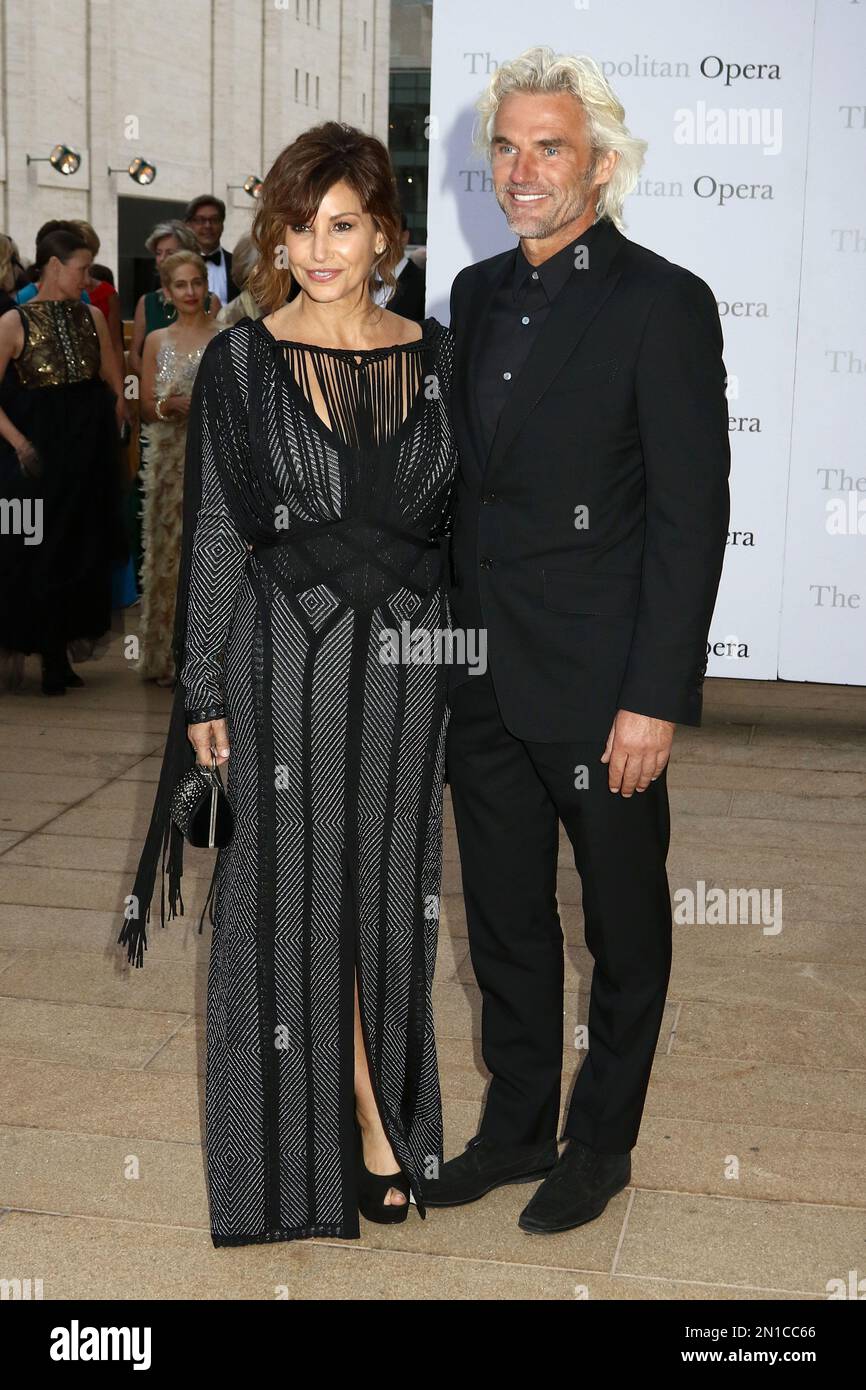 Gina Gershon, left, and Robert Dekeyser attend the Metropolitan Opera ...