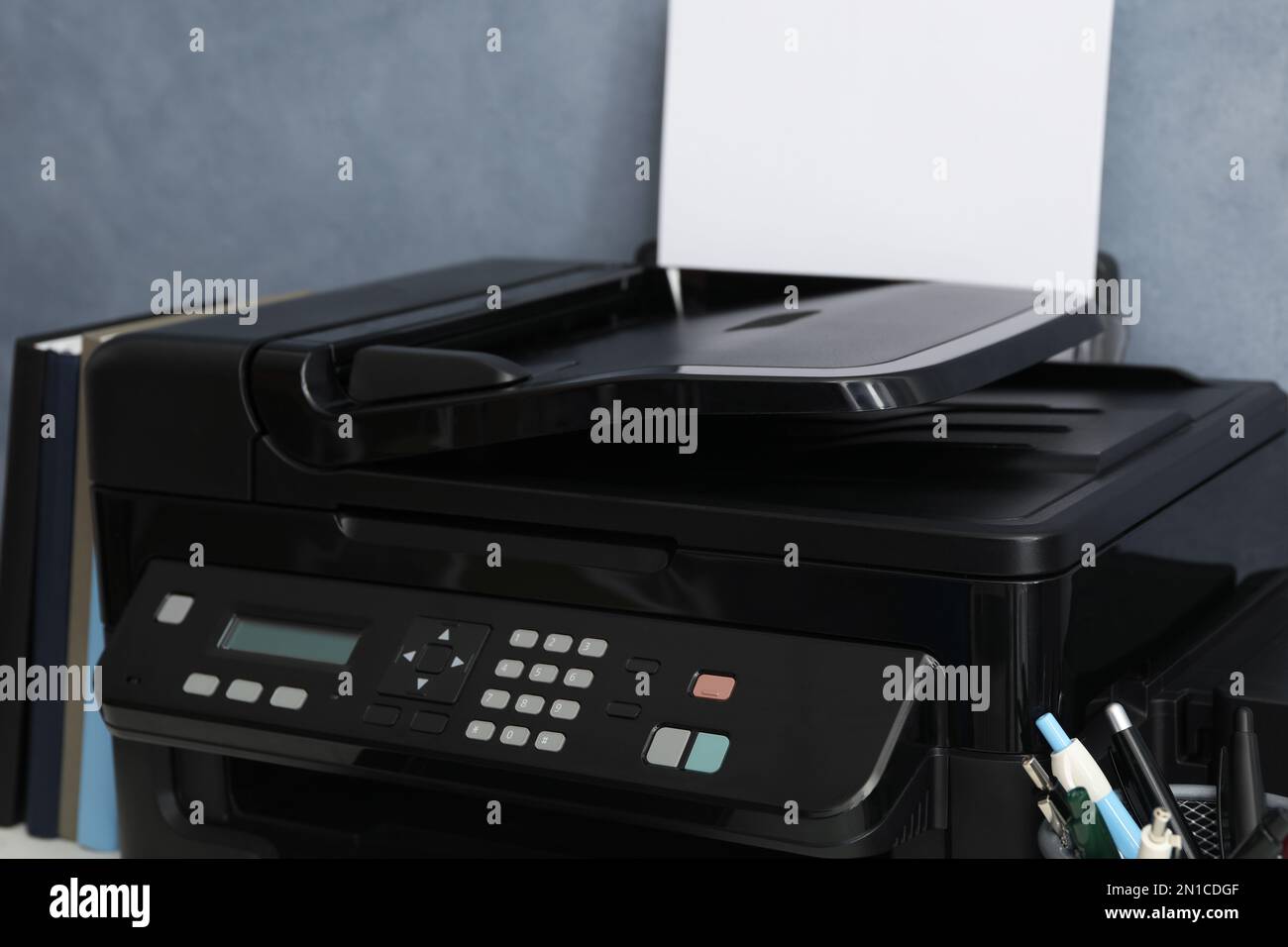 Closeup view of new modern black printer Stock Photo - Alamy