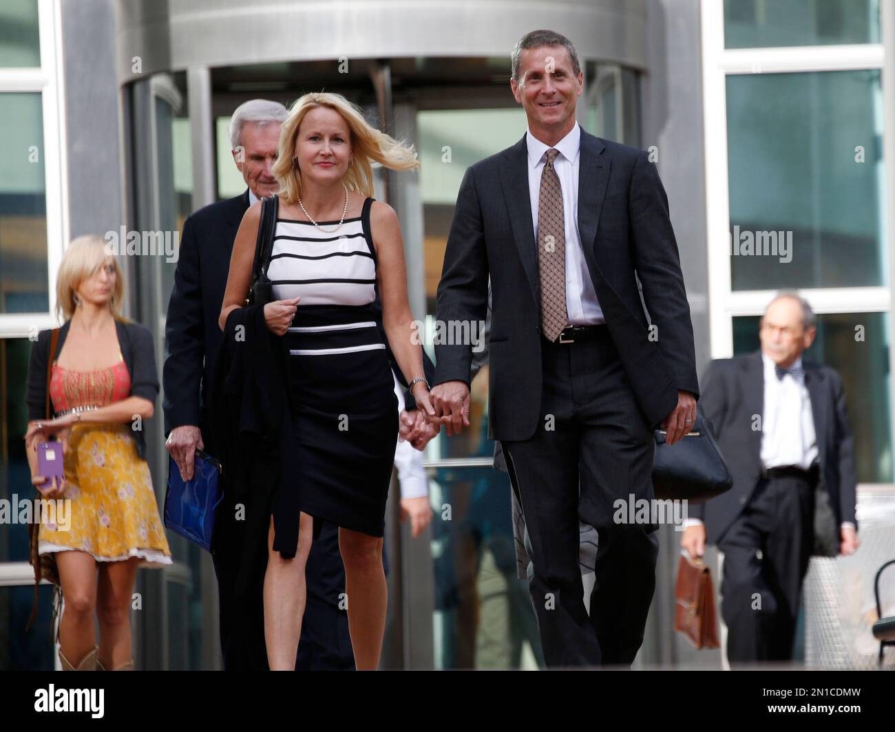 Paula Bertolet, front left, walks with her husband Barry Bertolet ...