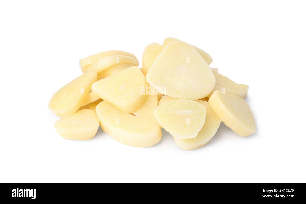 Pile of fresh sliced garlic cloves isolated on white. Organic food ...