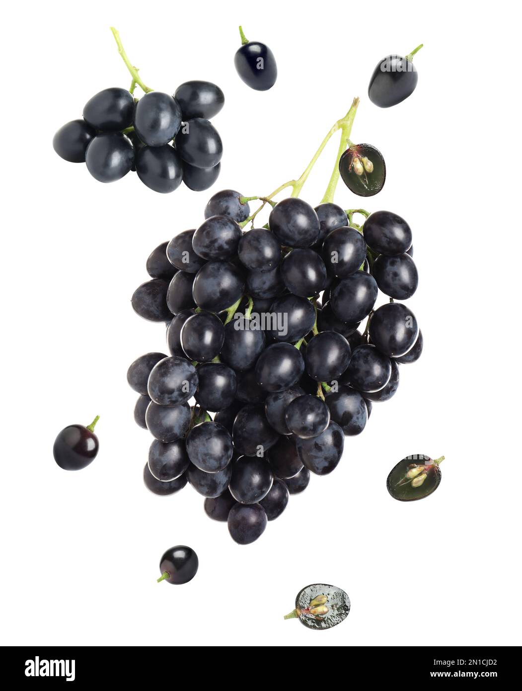 Fresh ripe grapes falling on white background Stock Photo - Alamy