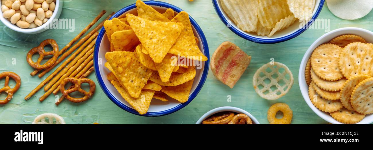 Tortilla and potato chips, salt crackers and other salty snacks, party ...
