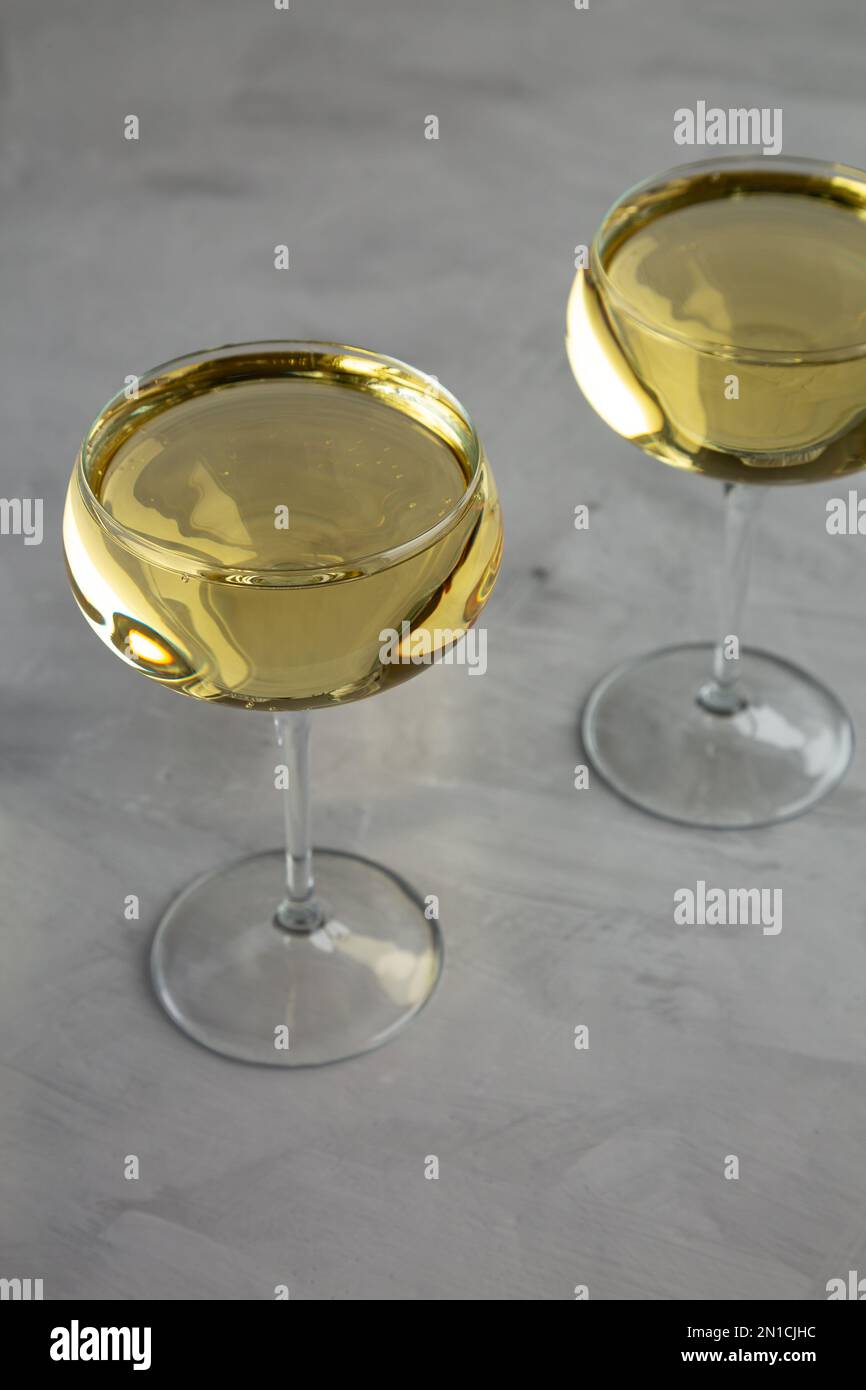Sparkling Champagne in a Coupe Glass on a gray background, side view ...