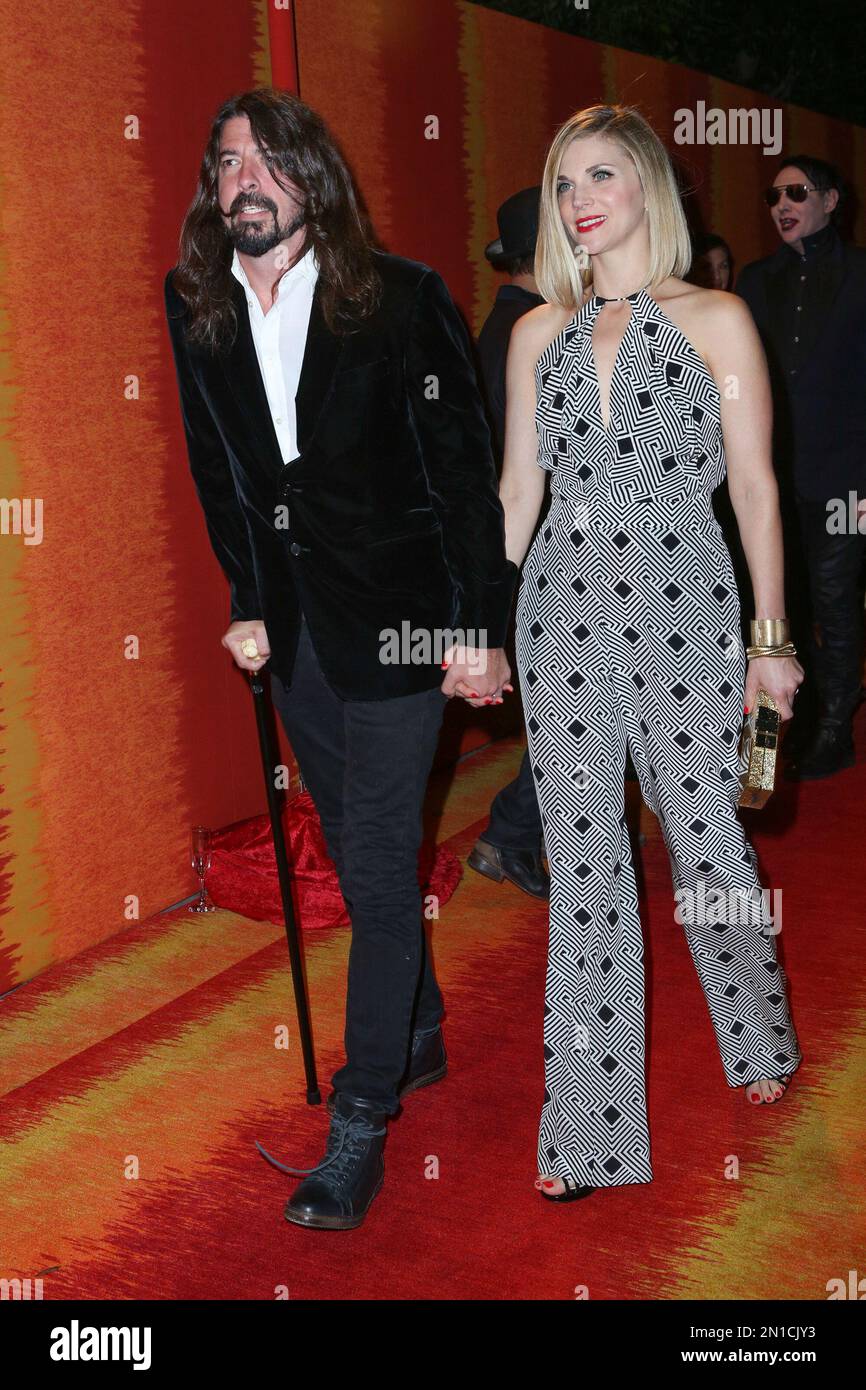 Dave Grohl, left, and wife Jordyn Blum Grohl arrive at the 2015 HBO ...