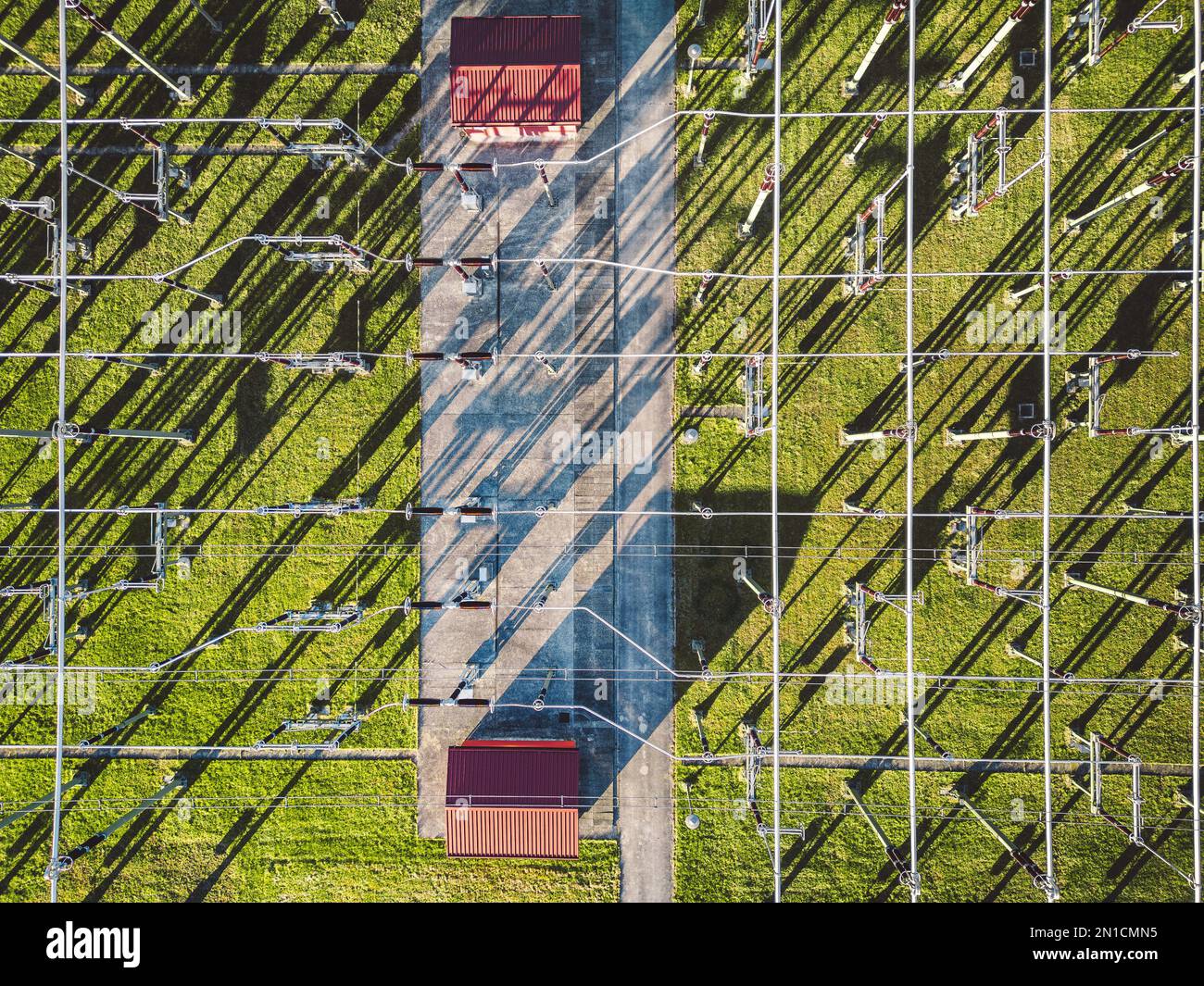 Directly above electrical substation with electrical wires spread ...