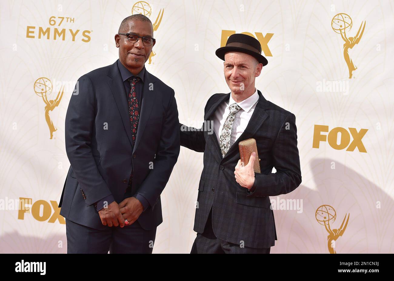 Hugo Redwood, left, and Denis O'Hare arrive at the 67th Primetime Emmy ...