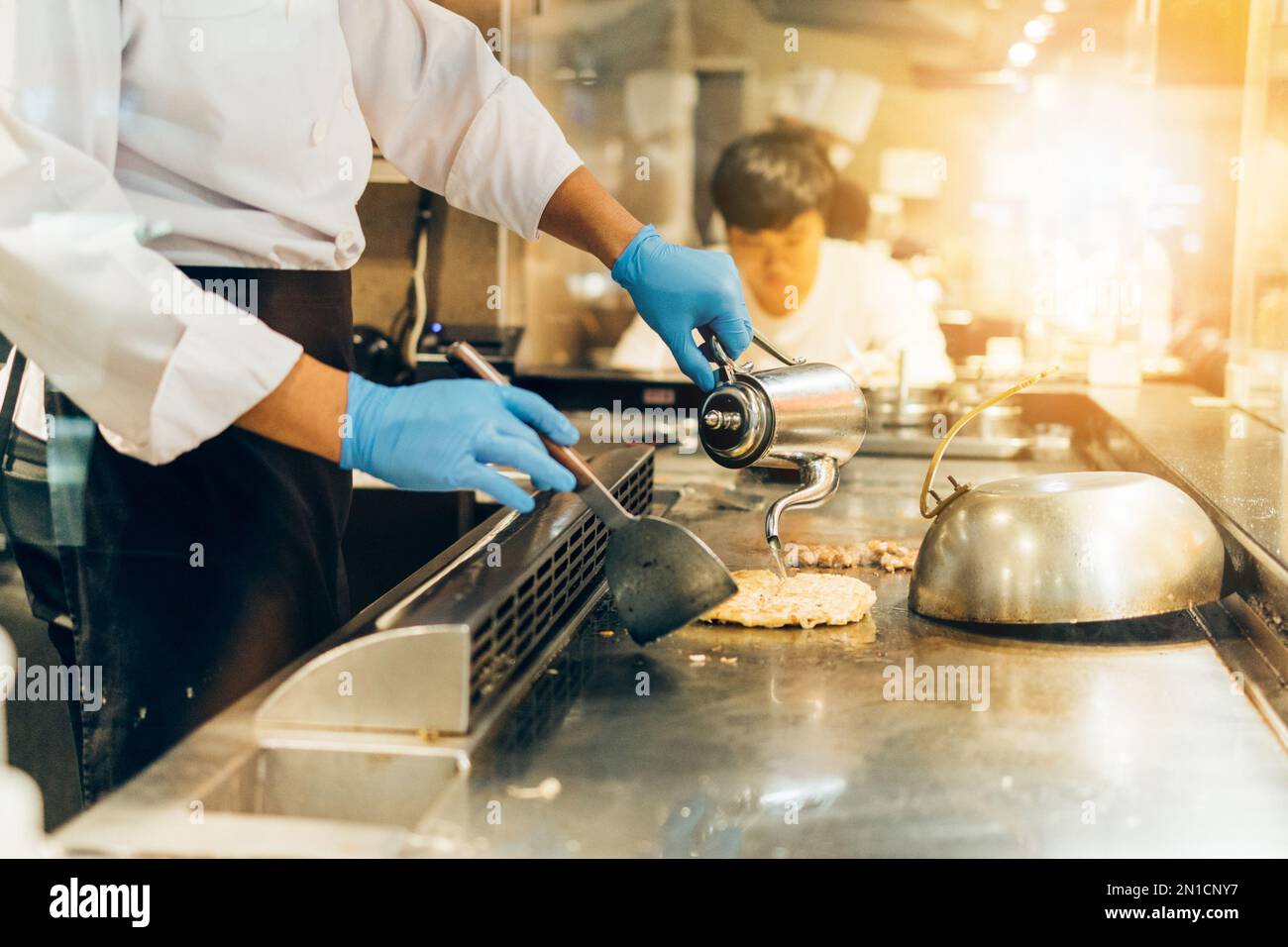 Hand of man take cooking of meat with vegetable grill, Chef cooking ...