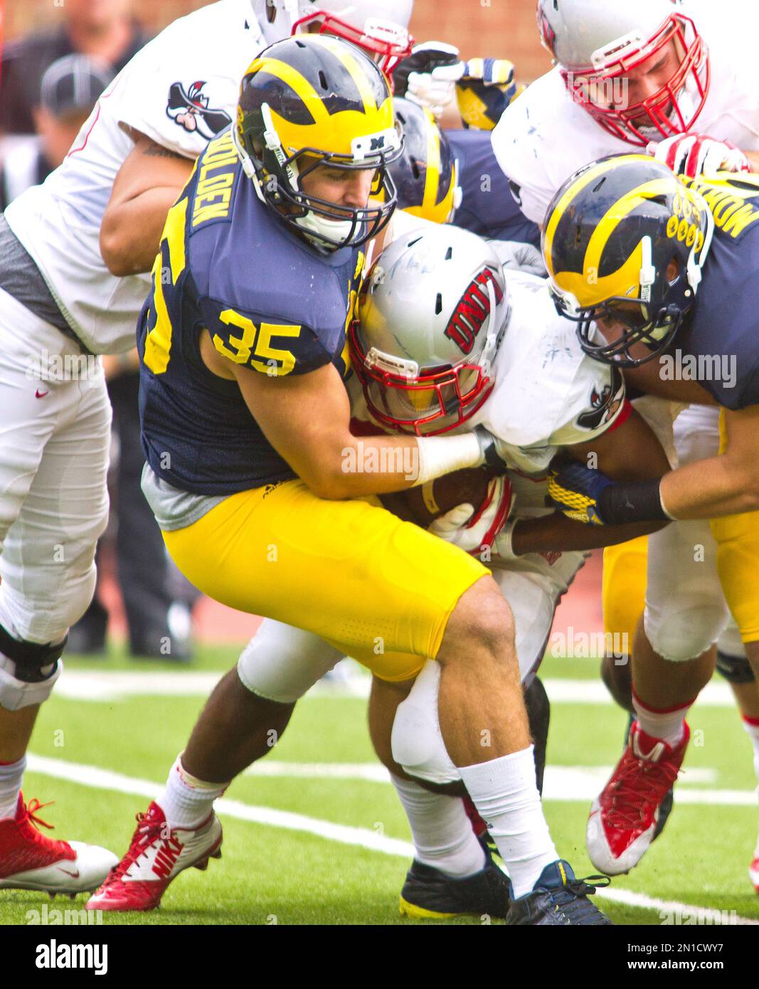 Michigan linebacker Joe Bolden (35) makes a tackle in the third quarter ...
