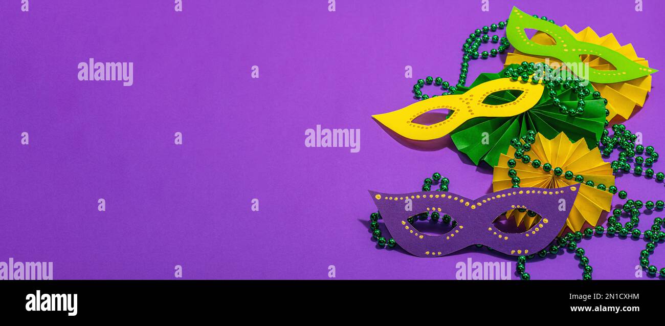 Festive Mardi Gras masquerade purple background. Fat Tuesday carnival ...
