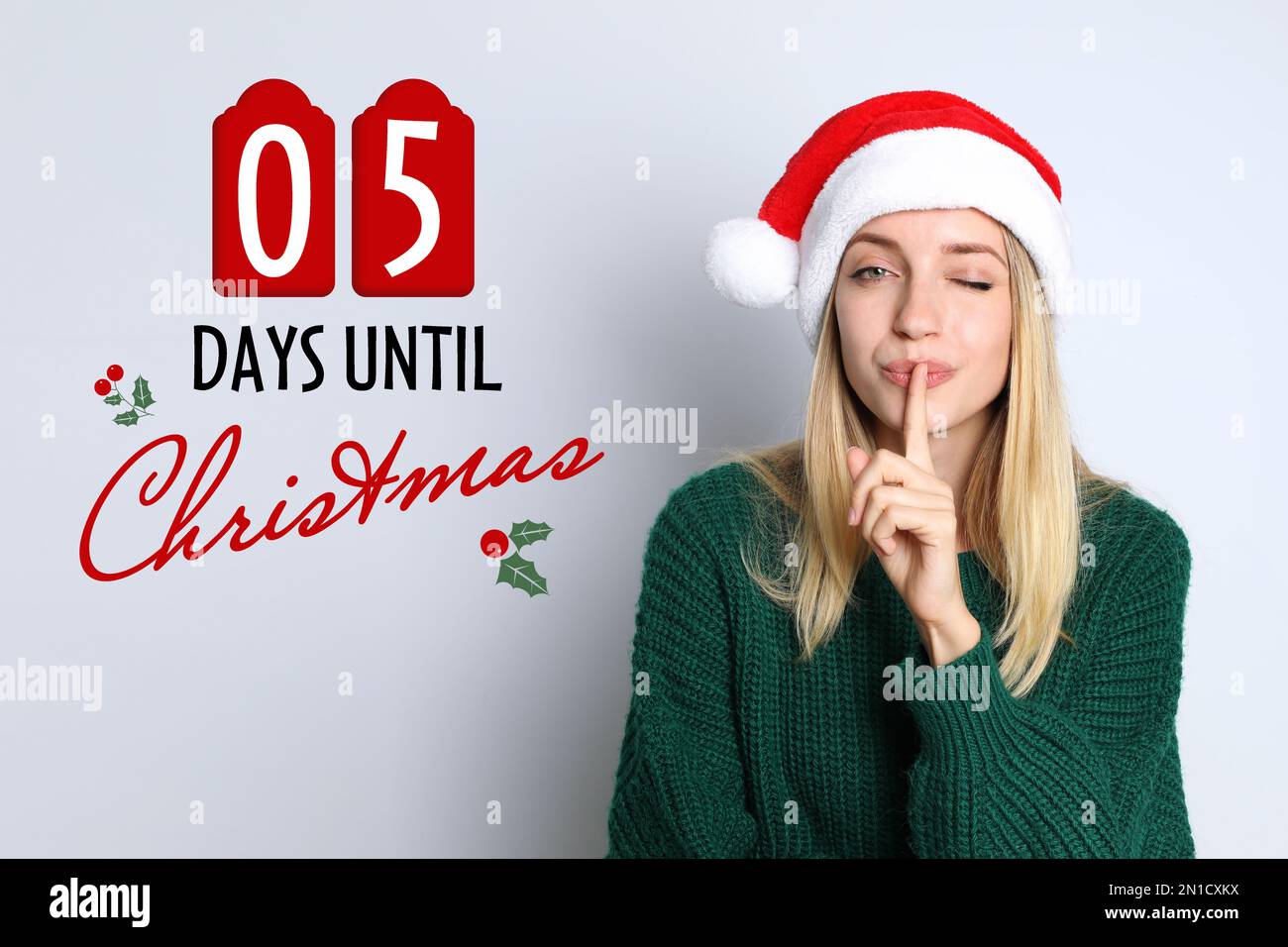 Christmas countdown. Woman in Santa hat showing silence gesture on ...
