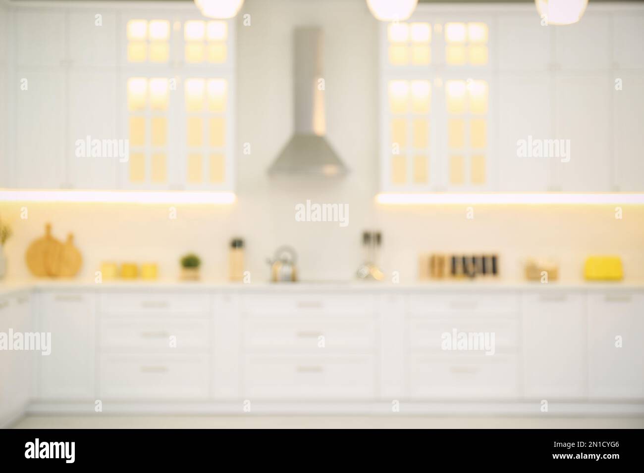 Blurred view of modern kitchen interior with stylish furniture Stock ...