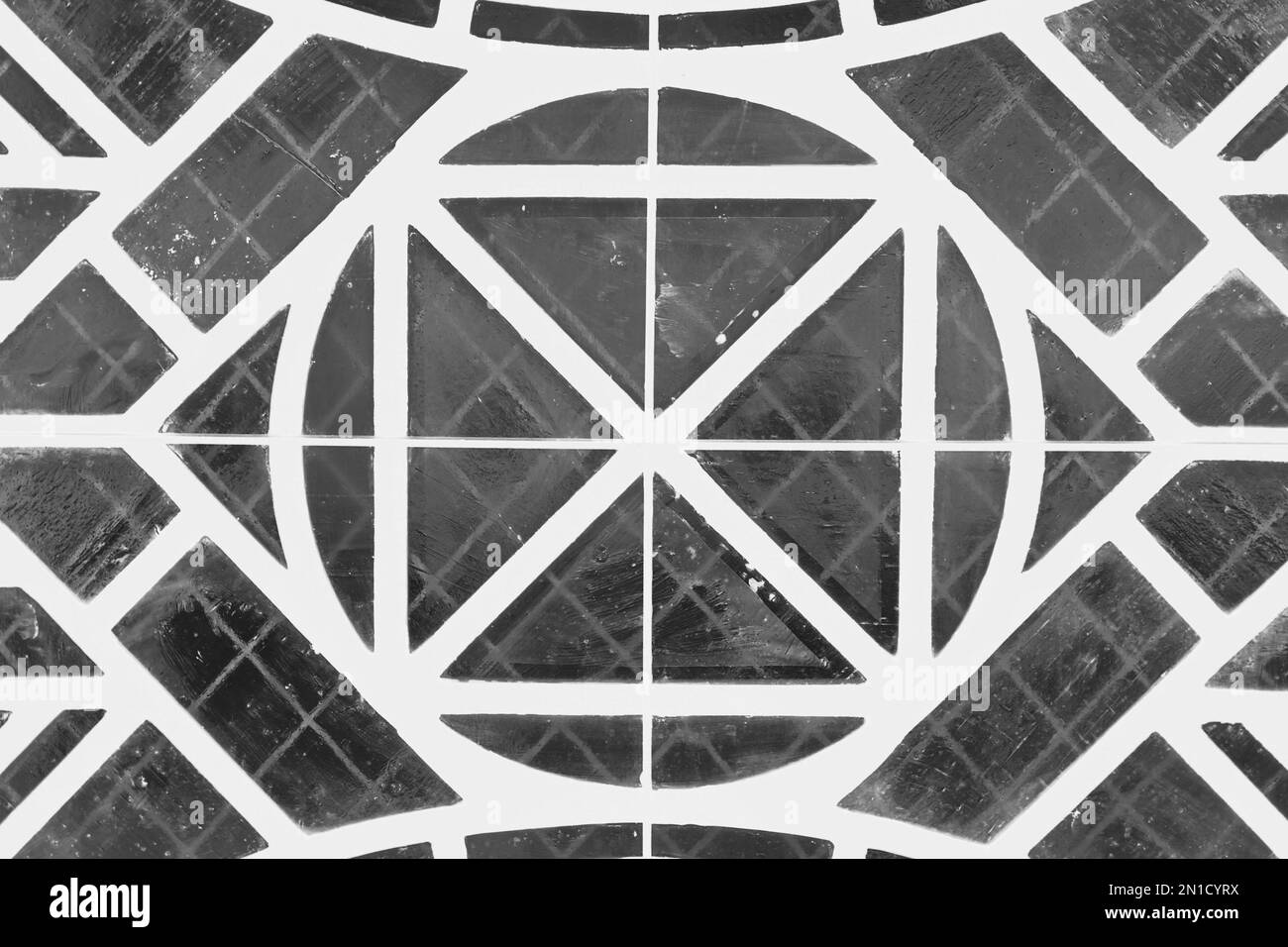 Geometric shapes of a beautiful medieval stained glass window in a ...