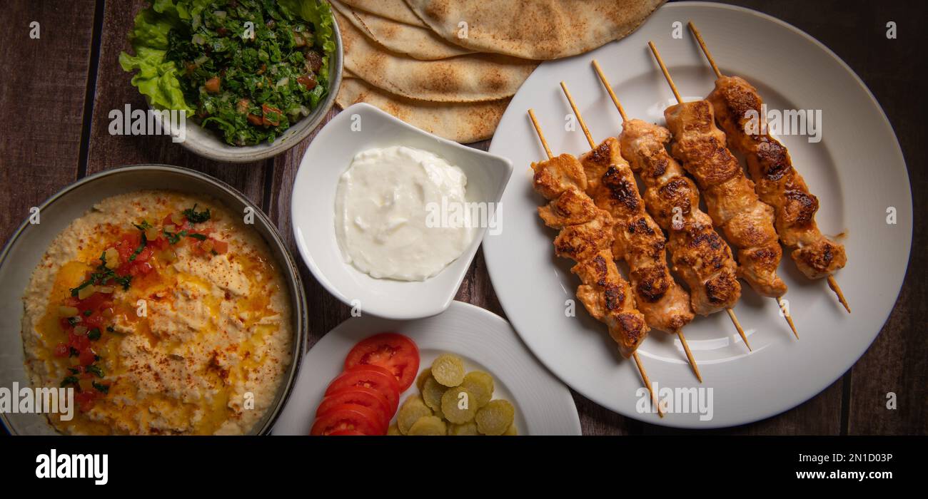 Lebanese recipe of chich taouk, garlic cream, toum, in a Lebanese bread ...