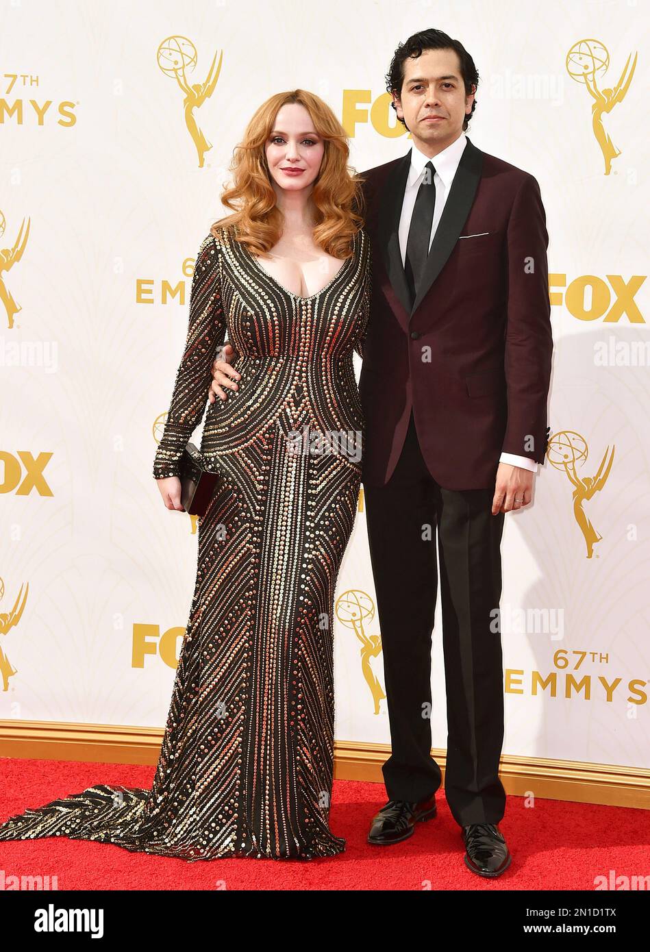 Christina Hendricks, left, and Geoffrey Arend arrive at the 67th ...