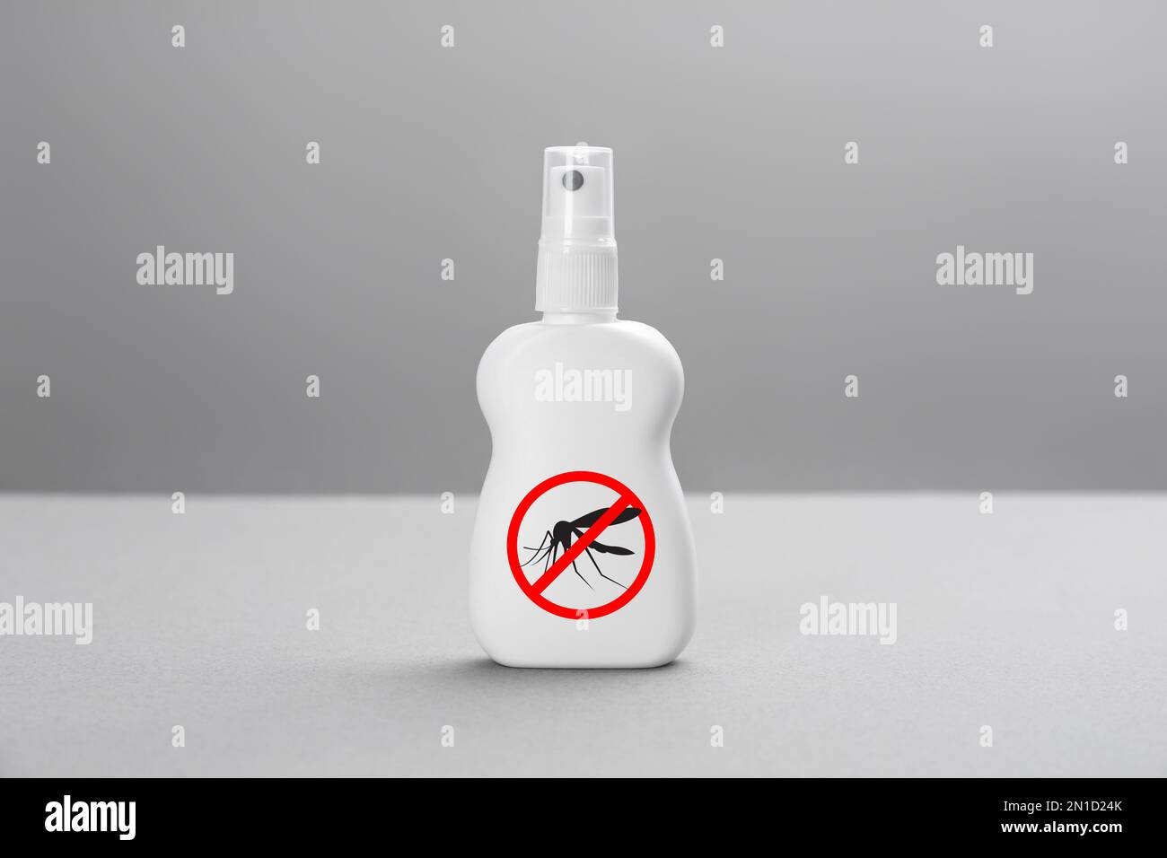 Bottle of insect repellent on grey background Stock Photo - Alamy