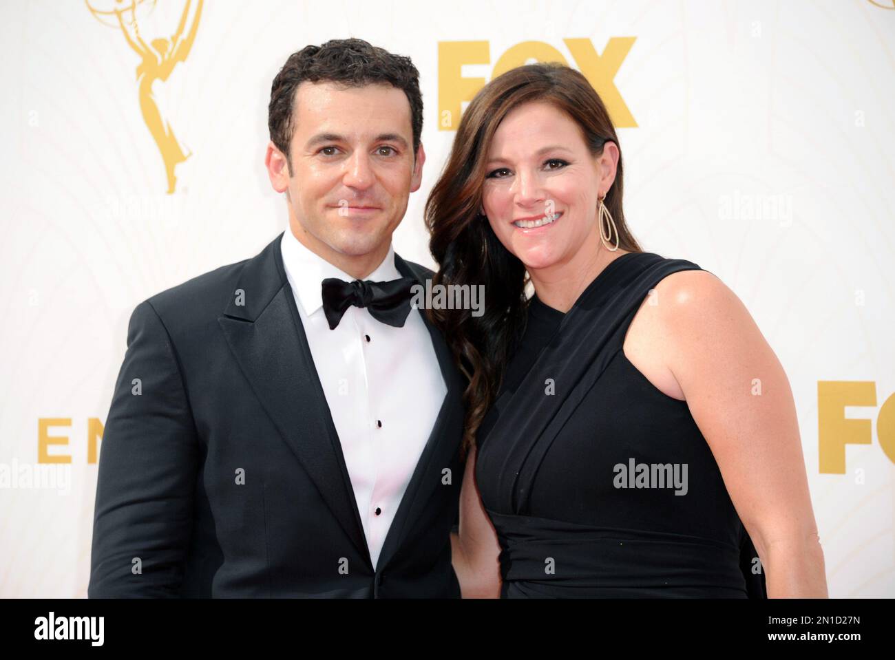 Fred Savage, left, and Jennifer Lynn Stone arrive at the 67th Primetime ...