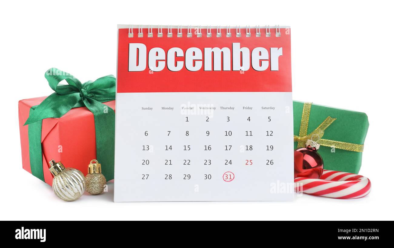 Flip calendar, gifts, Christmas balls and candy cane on white ...