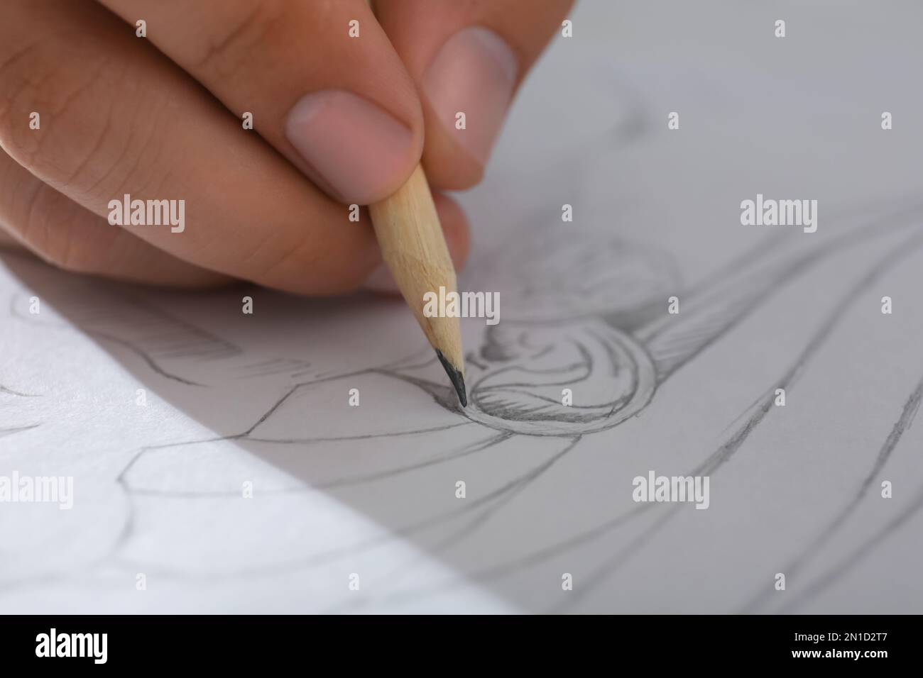 Man drawing portrait with pencil in notepad, closeup Stock Photo - Alamy