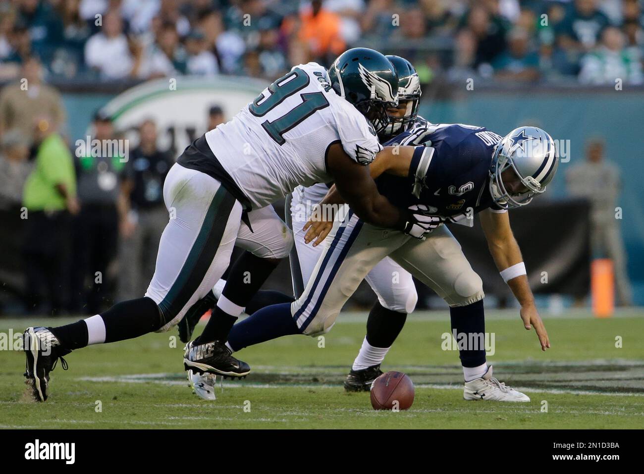 Dallas Cowboys' Tony Romo (9) fumbles the football against Philadelphia ...