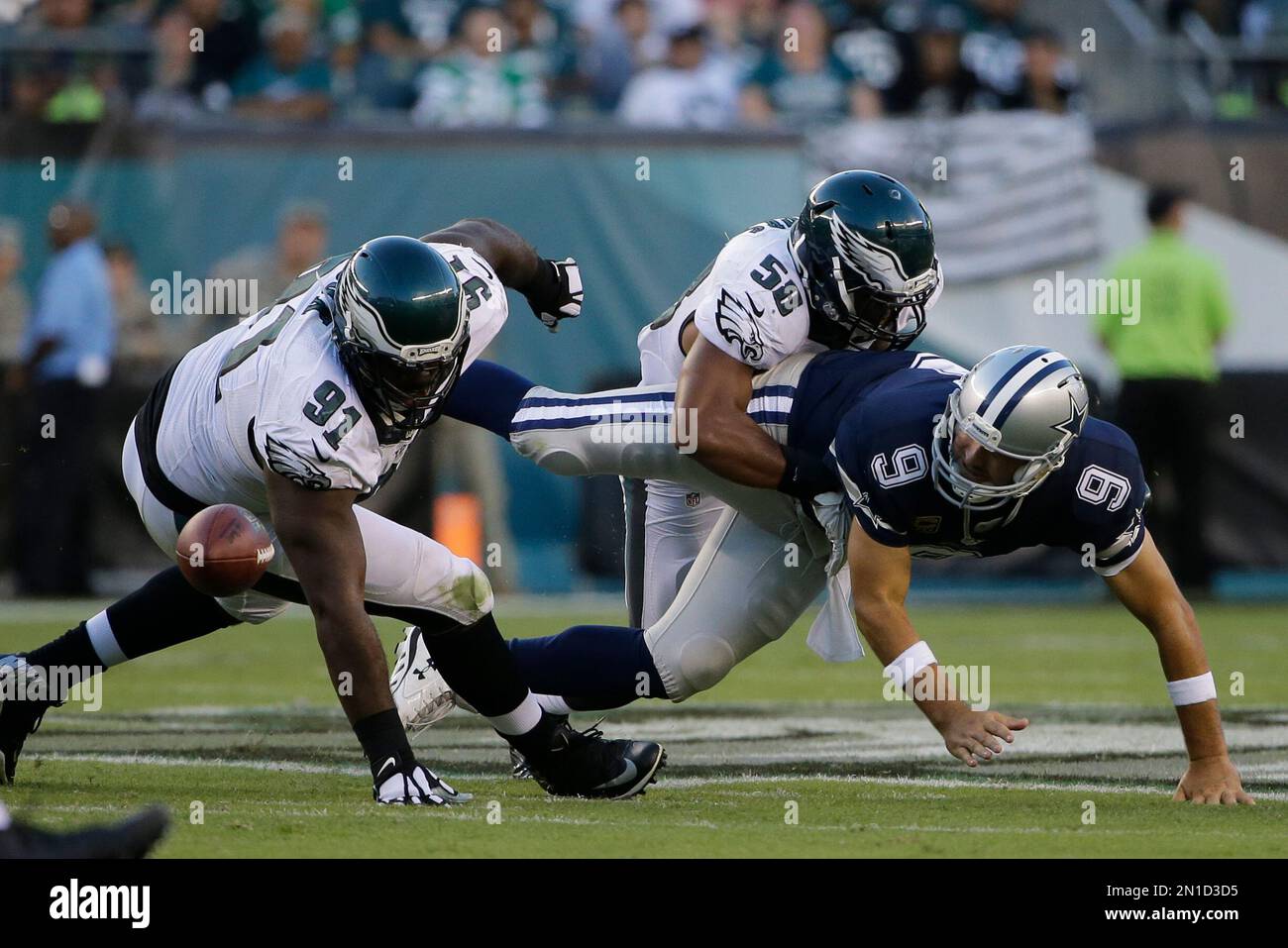 Dallas Cowboys' Tony Romo (9) fumbles the football against Philadelphia ...