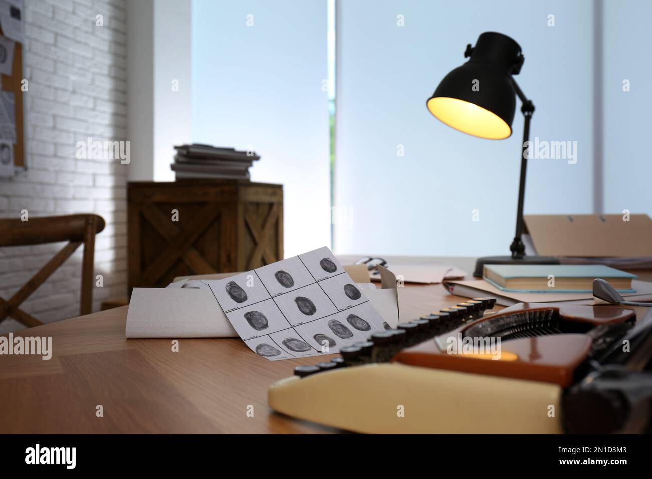 Detective workplace with vintage typewriter and fingerprints in office ...