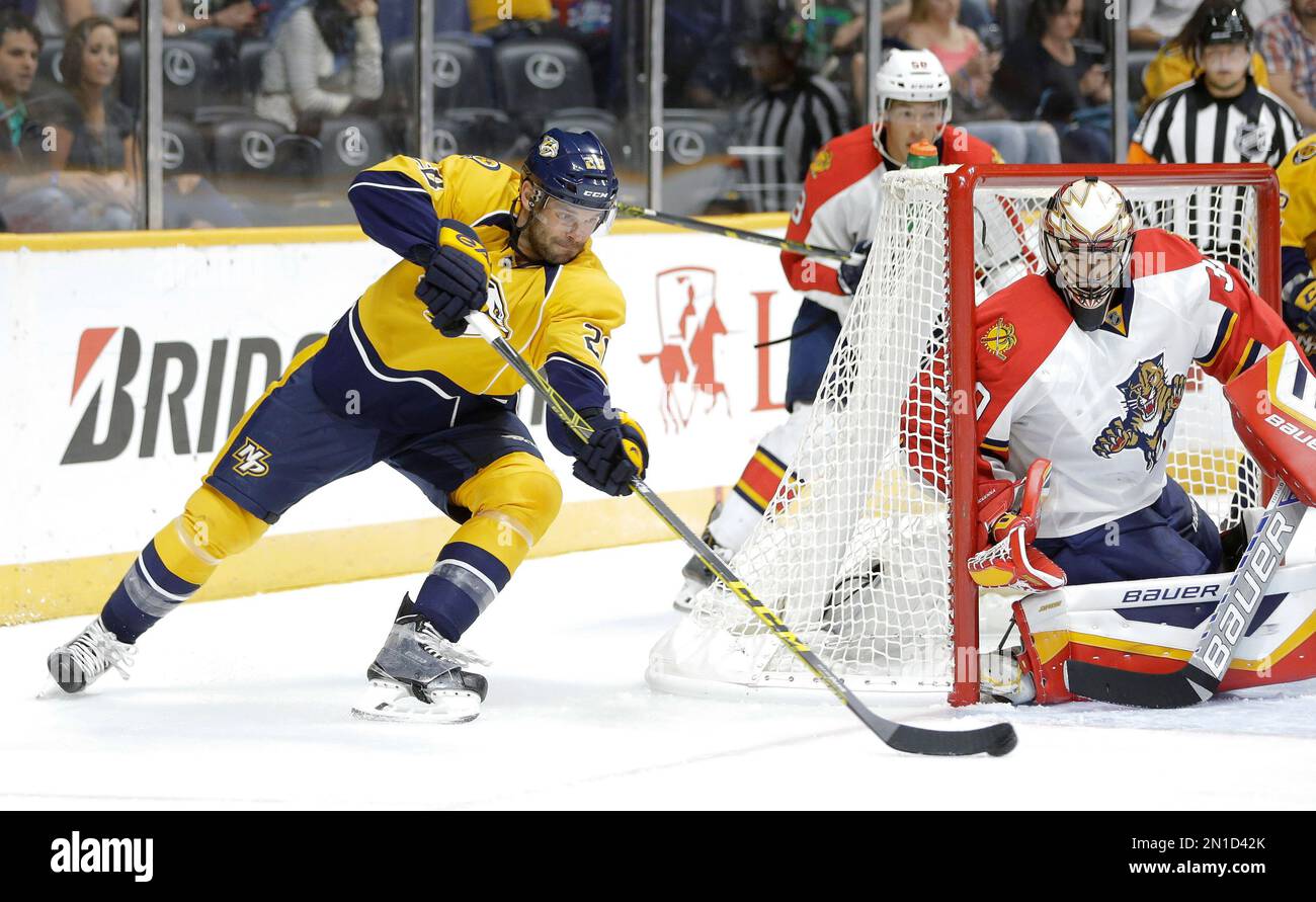 Nashville Predators center Paul Gaustad (28) shoots against Florida ...