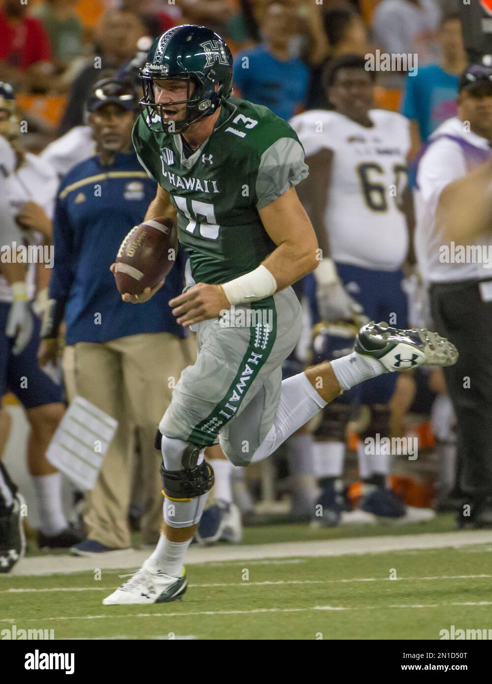 Hawaii quarterback Max Wittek (13) runs with the football in the fourth ...