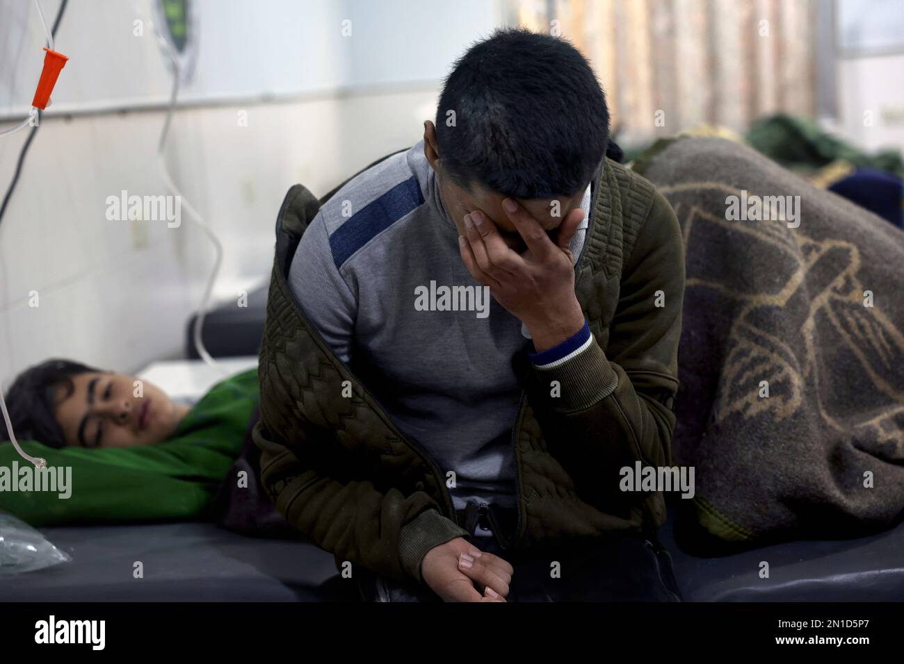 Earthquake victims receive treatment at the al-Rahma Hospital in the ...