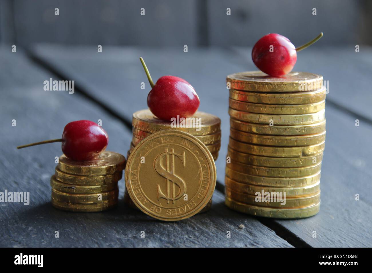 Golden coins on vintage background. Coin stacks Stock Photo - Alamy
