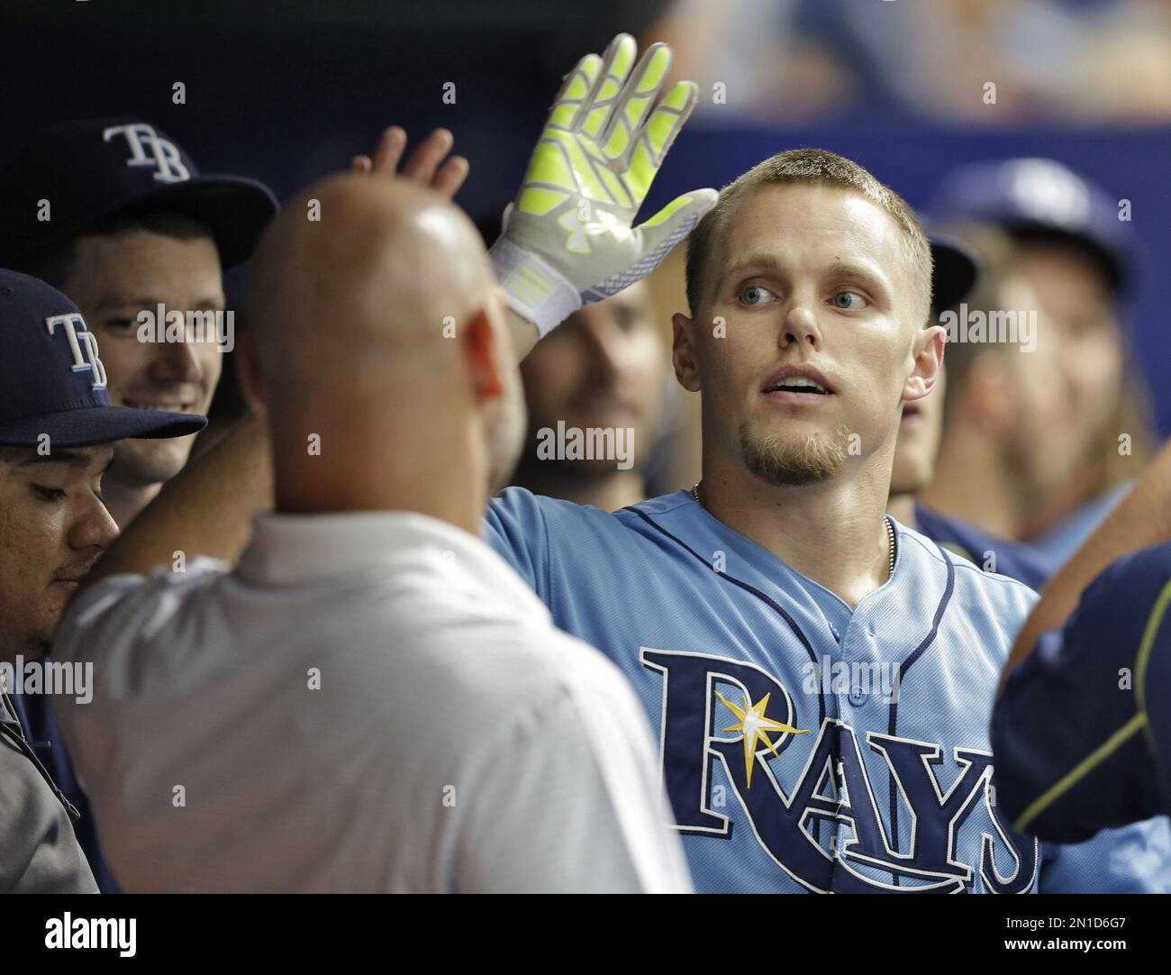 Tampa Bay Rays' Brandon Guyer, right, high fives teammates in the ...