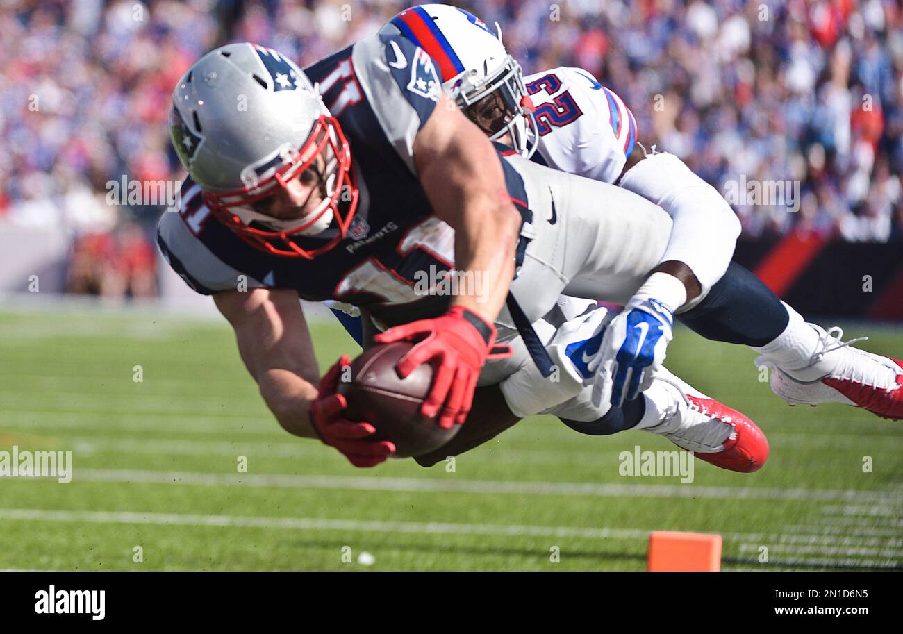 New England Patriots wide receiver Julian Edelman (11) dives past ...