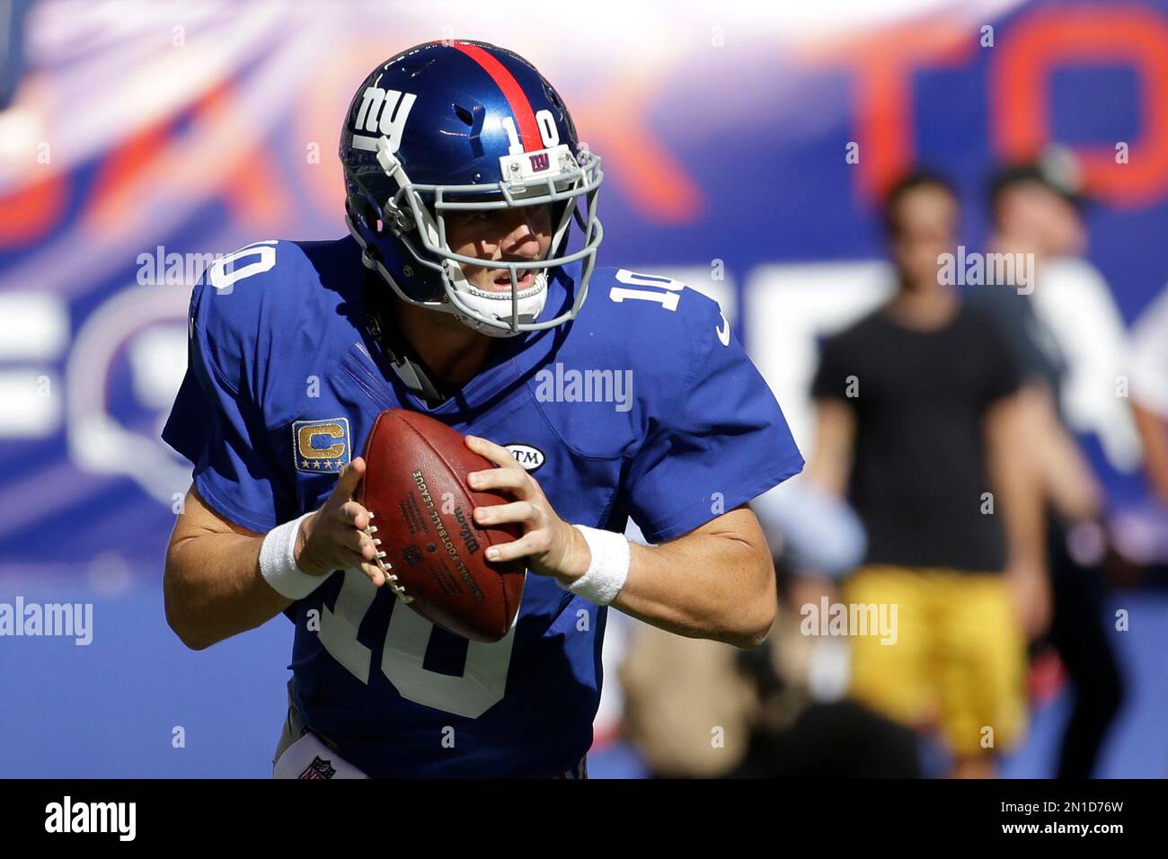 New York Giants quarterback Eli Manning looks to pass against the ...