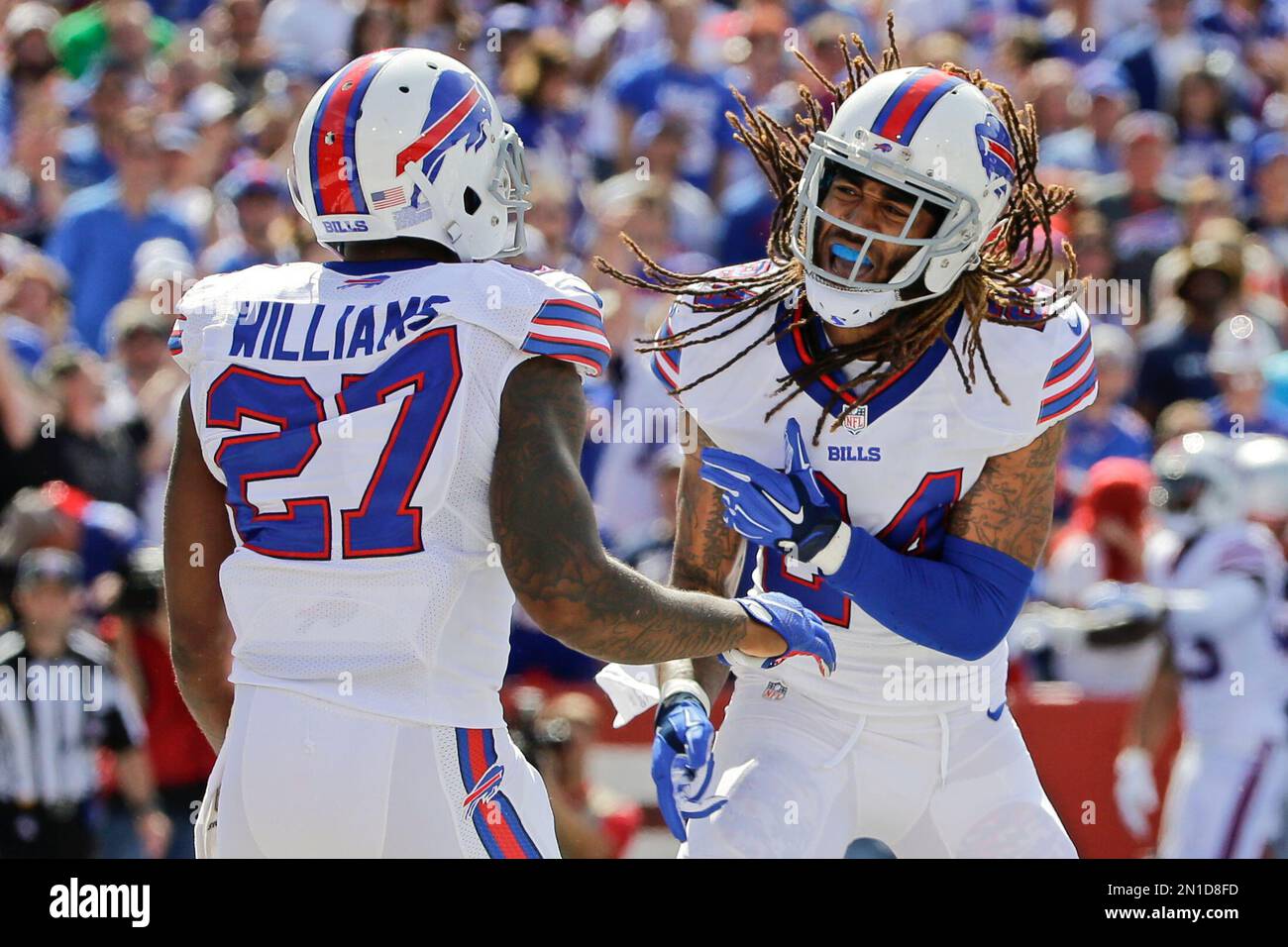 New England Patriots' Bradley Fletcher (24) and Tavon Wilson (27) react ...