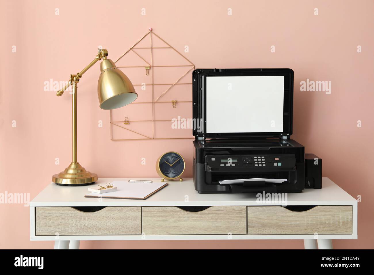 New modern printer with paper on white table at workplace Stock Photo ...
