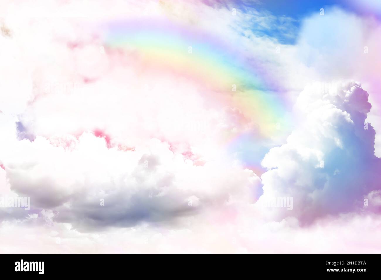 Fantasy world. Beautiful rainbow in sky with fluffy clouds Stock Photo ...
