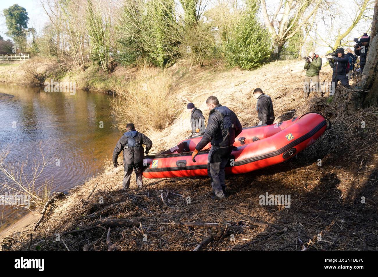 Workers from a private underwater search and recovery company ...