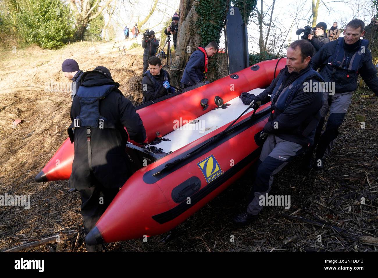 Workers from a private underwater search and recovery company ...