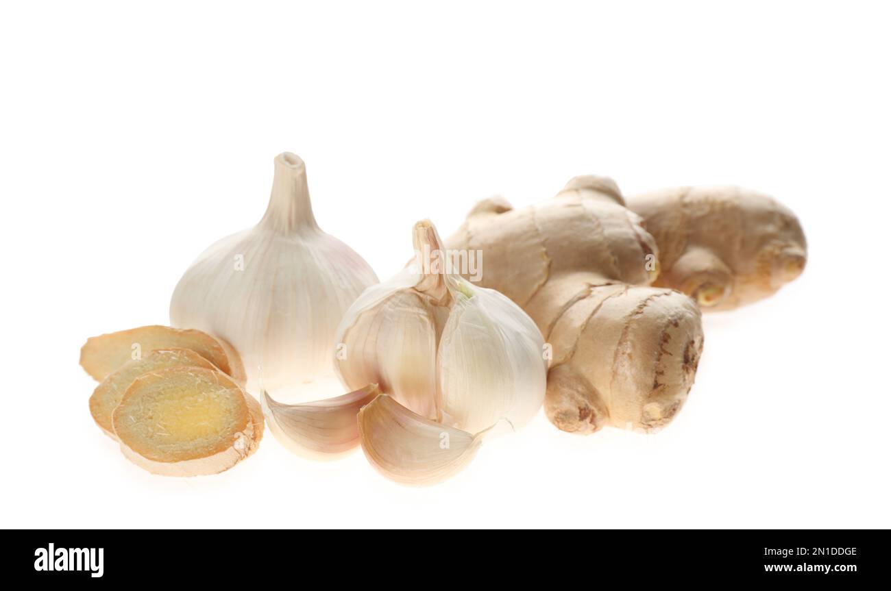 Ginger and fresh garlic on white background. Natural cold remedies ...