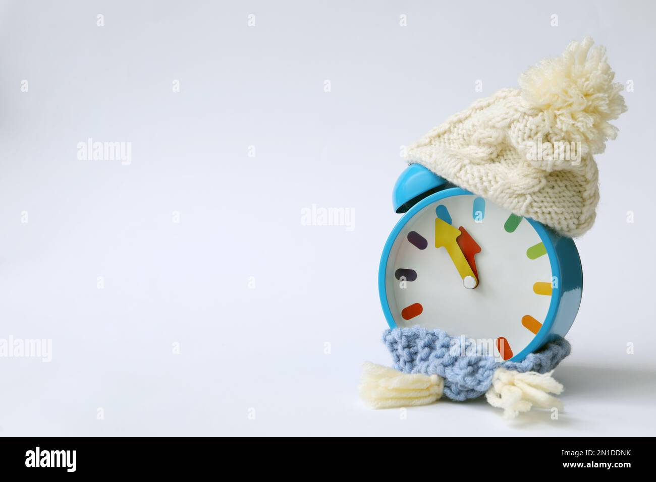 Alarm clock in hat on white background. New Year countdown Stock Photo ...