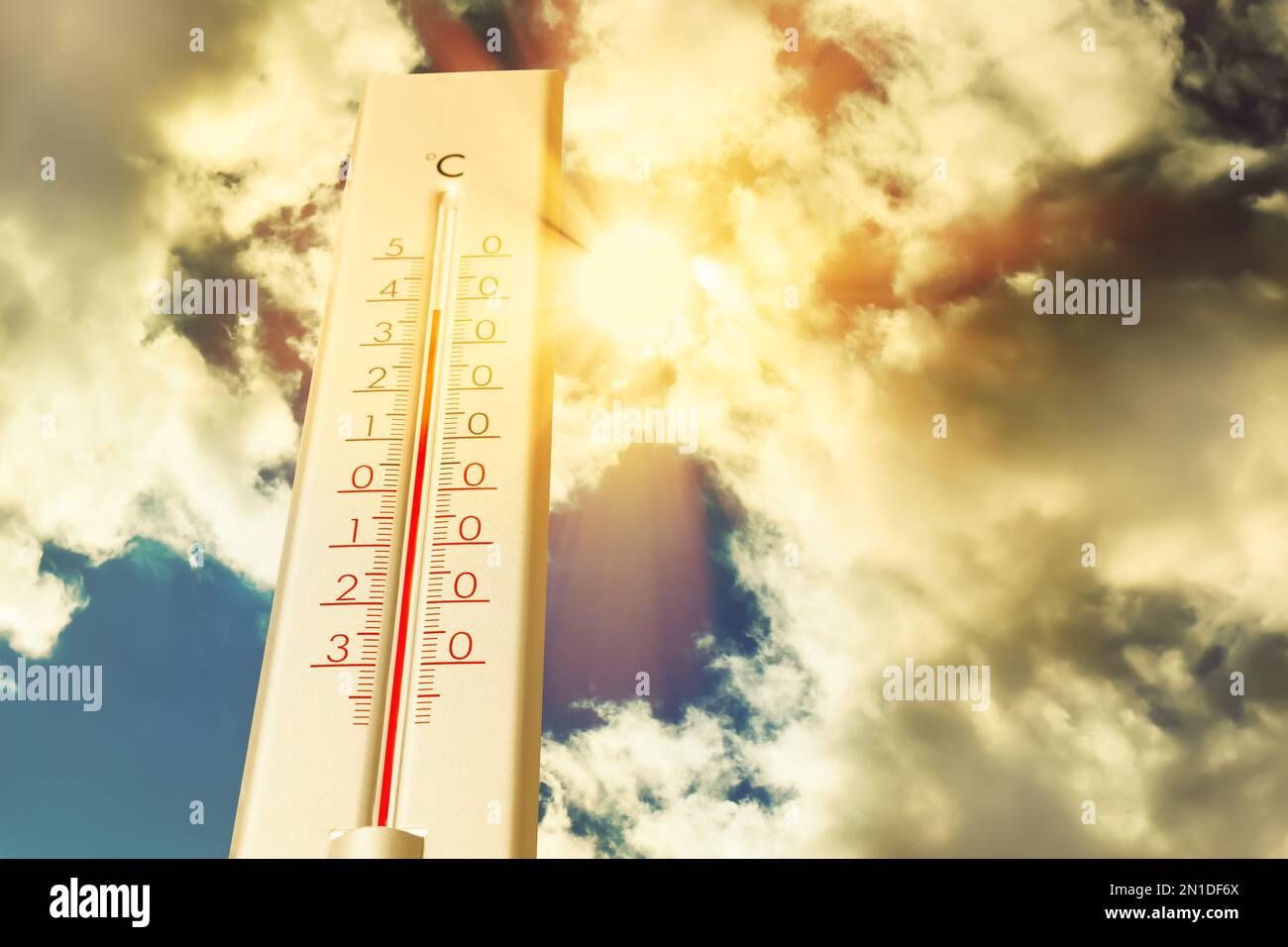 Weather thermometer showing high temperature and sunny sky with clouds ...