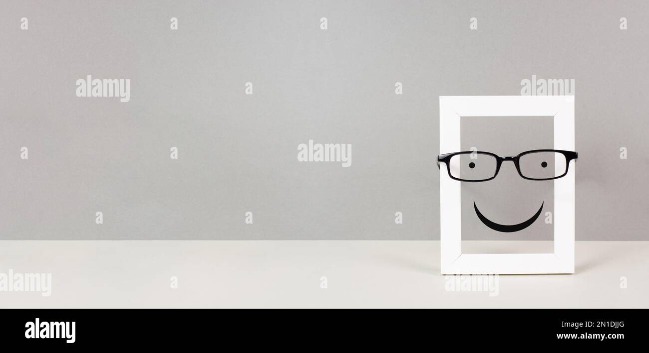 Picture frame, head with a smiling face, mental health concept ...