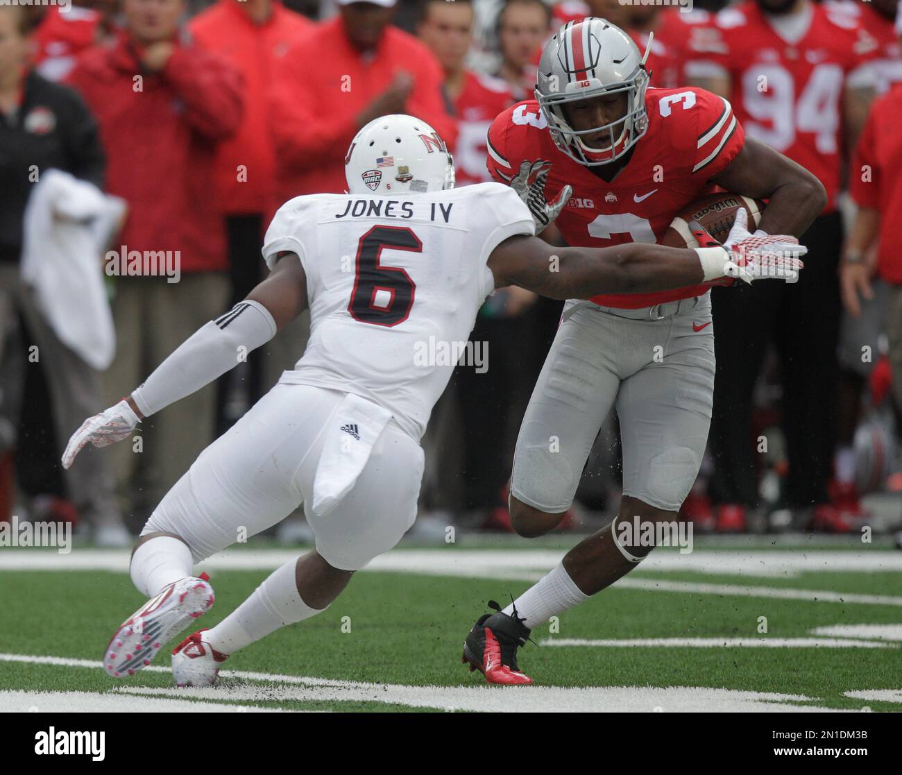 Ohio State wide receiver Michael Thomas, right, tries to run past ...
